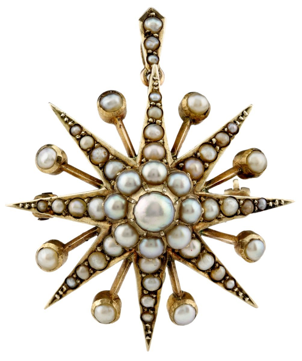41 - A Pearl & Gold Star Brooch / Pendant The star design set with gr...